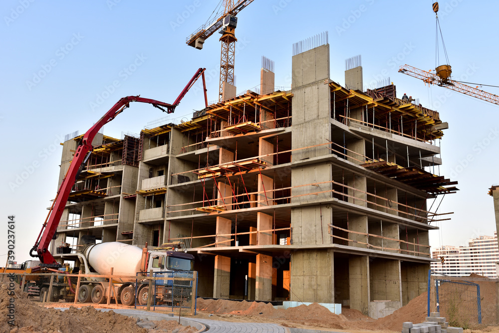 Formworks and pouring concrete through a сoncrete pump truck connected ...