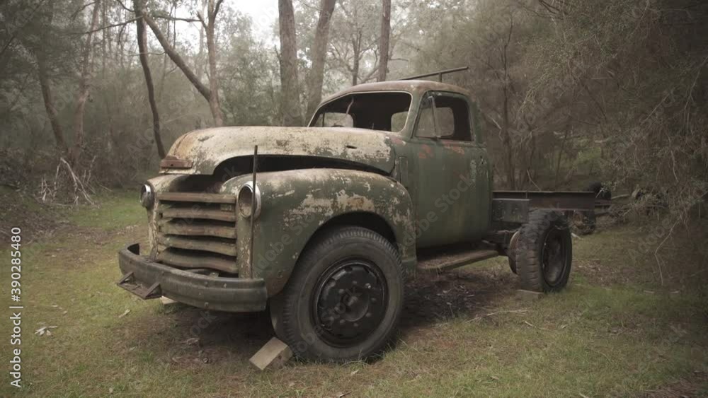 A creepy old rusted American chevy truck lies abandoned in the fog. The ...