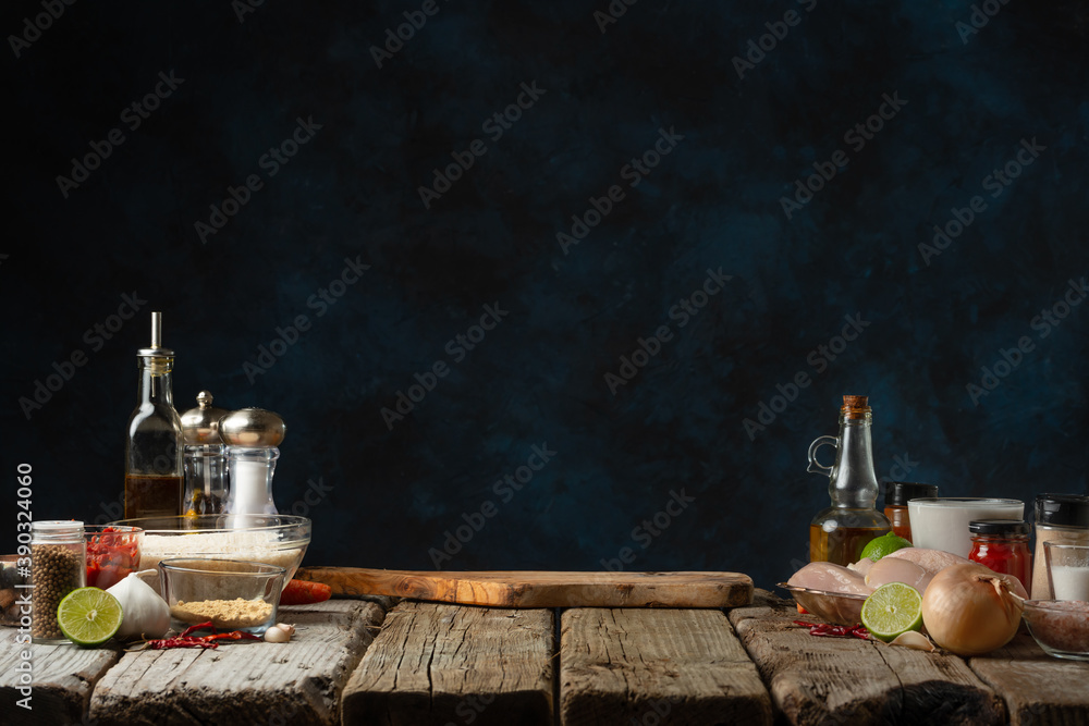 Workplace for cooking. Rustic wooden table with chopped board and ...