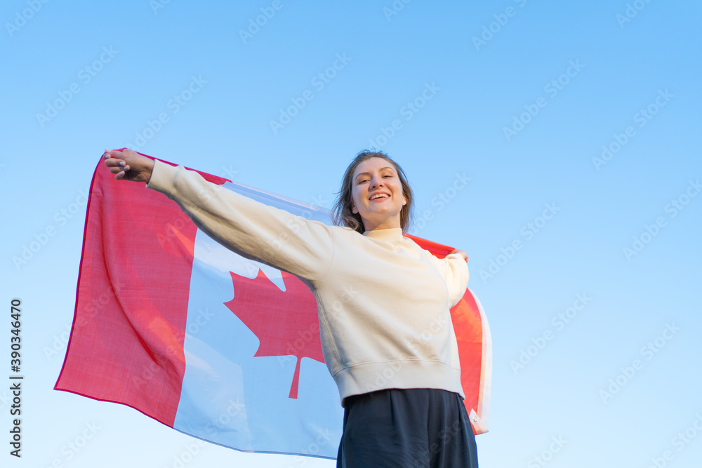 Canada Day. The national symbol of the country. Canadian flag waving in ...
