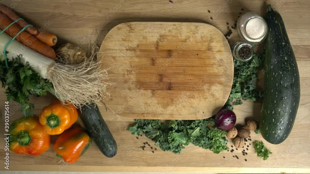 Cutting board top view. The man puts down and takes the knife ...