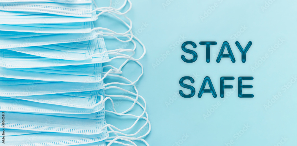 Pandemic personal protective equipment, text STAY SAFE. COVID-19 SARS ...