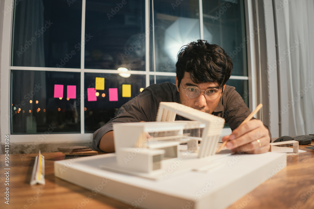 Asian man architect making architecture model of house. Stock Photo ...
