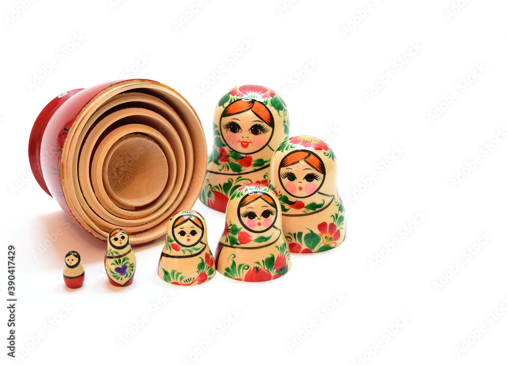 Heads from nesting dolls are lined up in a semicircle around the ...