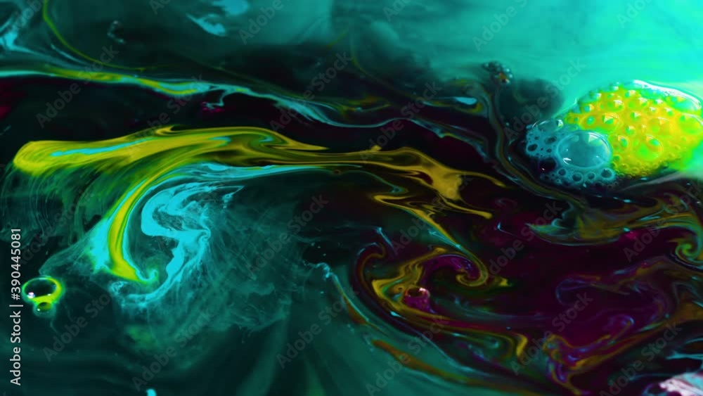 A galaxy of ink is spread apart by a splash of red ink, This slowly ...