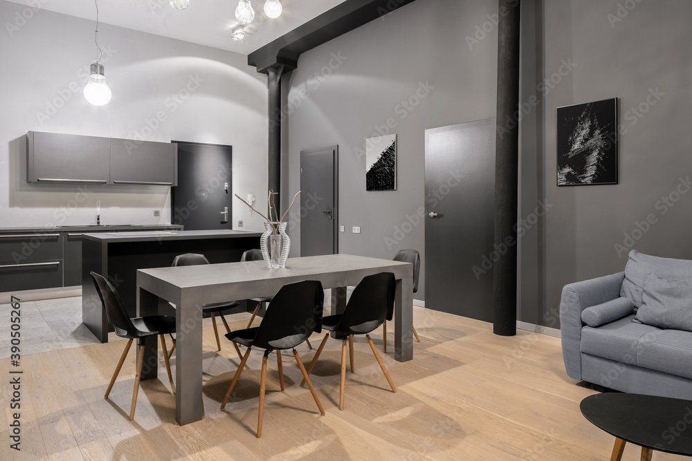 Big dining table in loft apartment Stock Photo | Adobe Stock