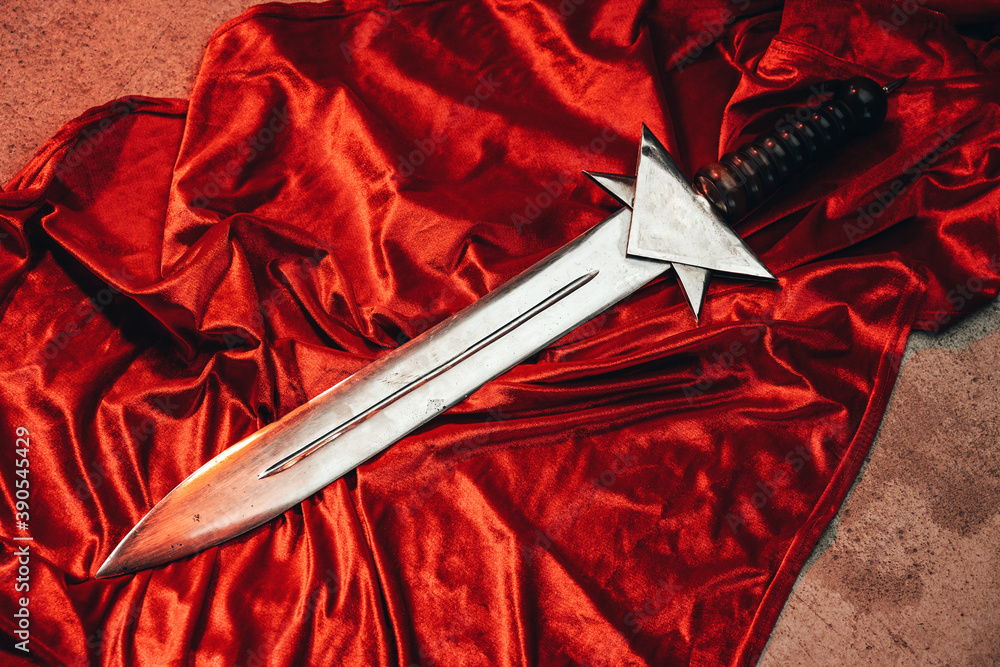 Flawless short roman sword its on red cape. Single bronze gladius on ...