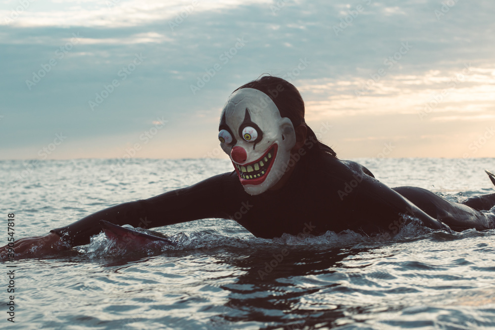 Halloween Costume Surfing Various scary costumes worn by a surfer while ...