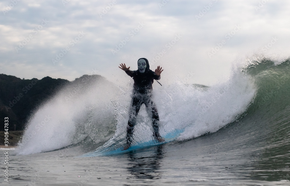 Halloween Costume Surfing Various scary costumes worn by a surfer while ...