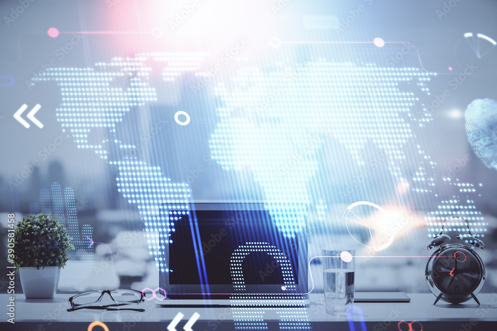 Double exposure of desktop with computer and world map hologram ...