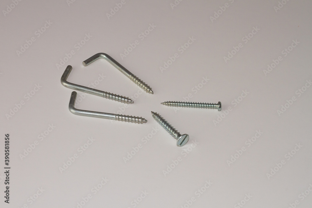 Wall anchoring screws with right angle hooks with zinc coating on white ...