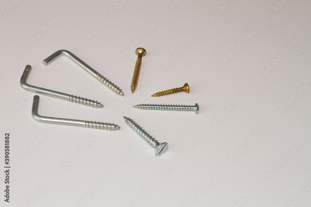Wall anchoring screws with right angle hooks with zinc coating on white ...