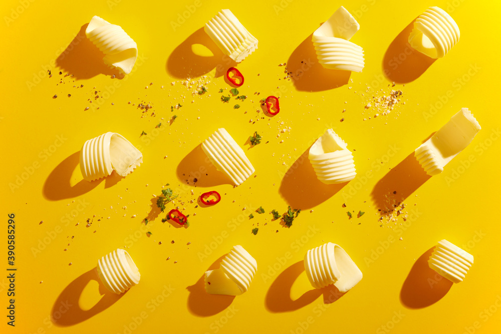 Elegant butter curls on a yellow background Stock Photo | Adobe Stock