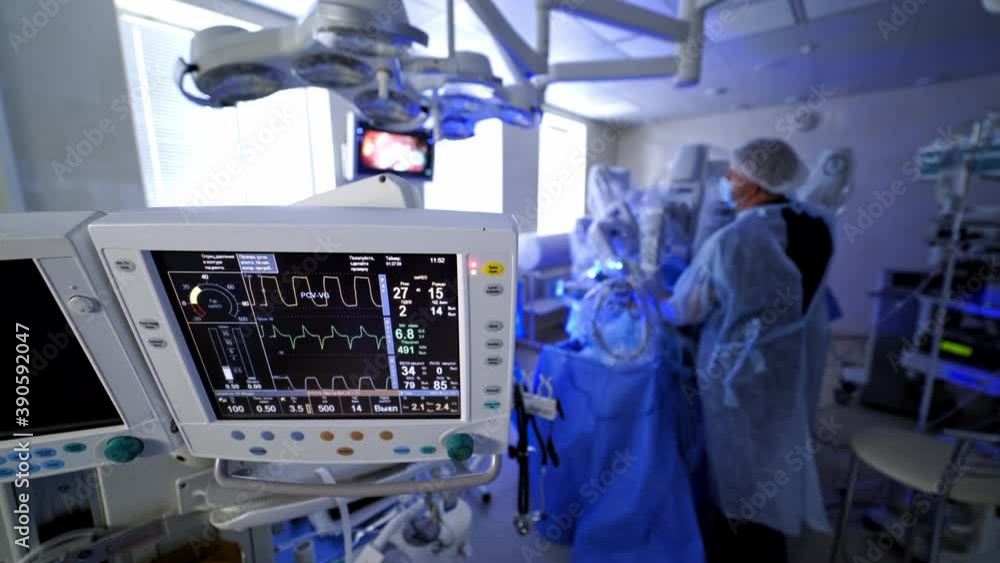 Graphs on the screen of medical monitor. Surgical room with medical ...