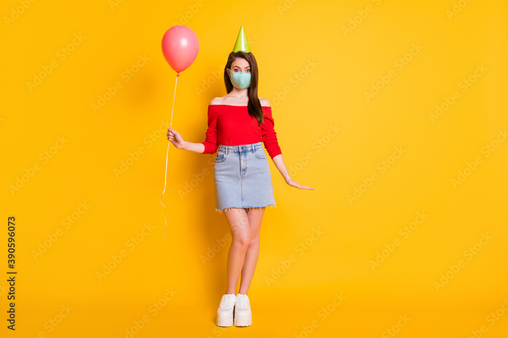 Full length photo of positive girl in medical mask have festive ...