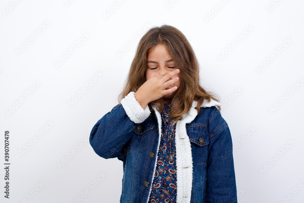 Little caucasian girl with beautiful blue eyes wearing denim jacket ...