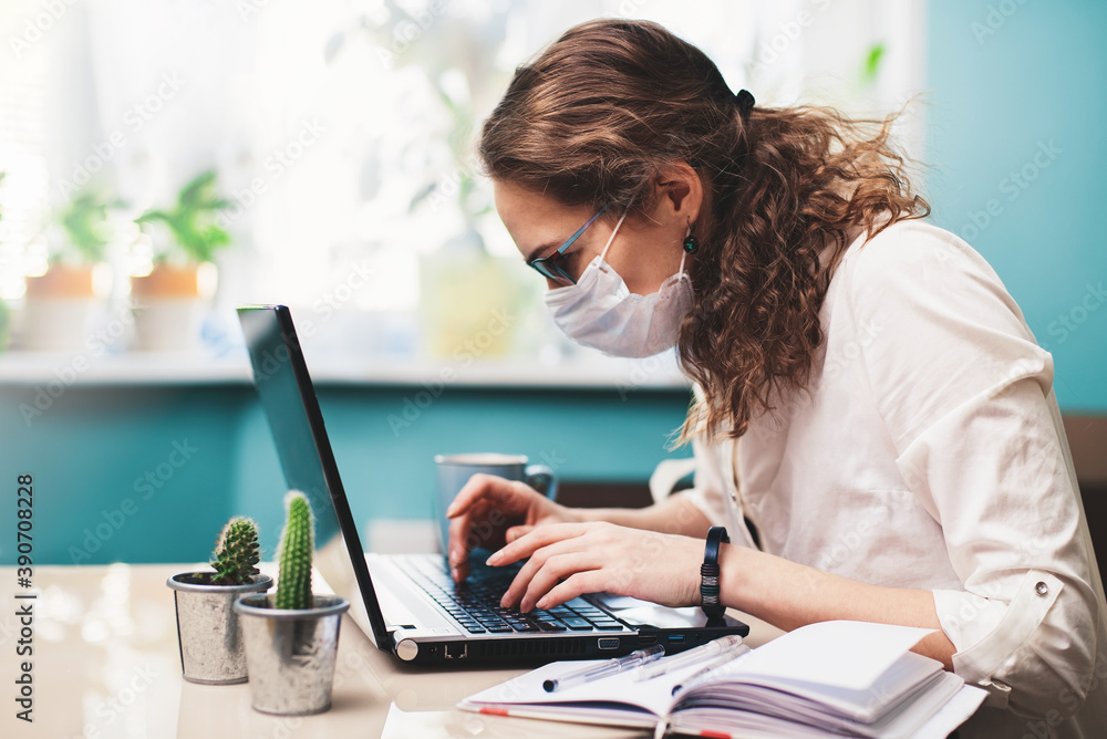 Distance learning. Online education or work. Woman in respiratory mask ...