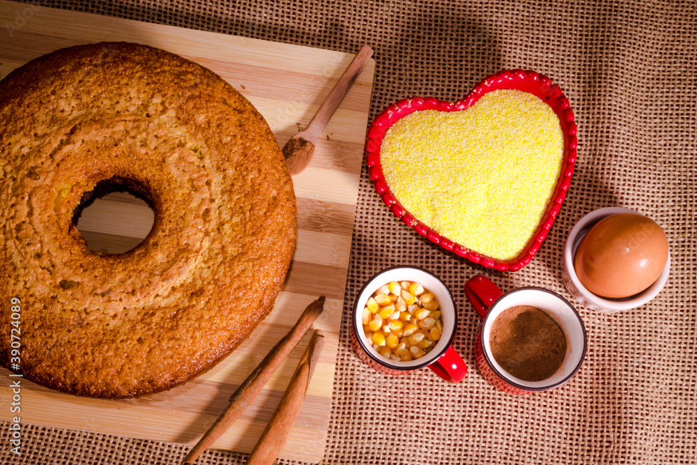 Brazilian corn cake made with a type of corn flour (Fuba) on the wood ...