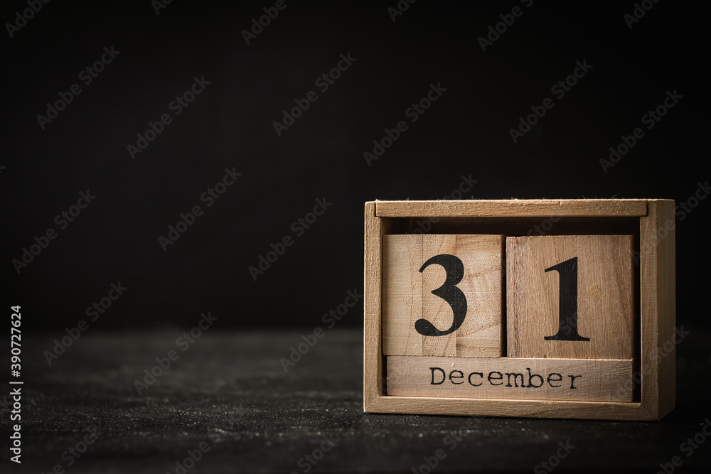 Closeup of the wooden calendar of blocks with the date of December 31 ...