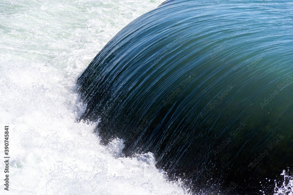 Foto de Closeup of the turbulent waters of a low-head dam, or low head ...