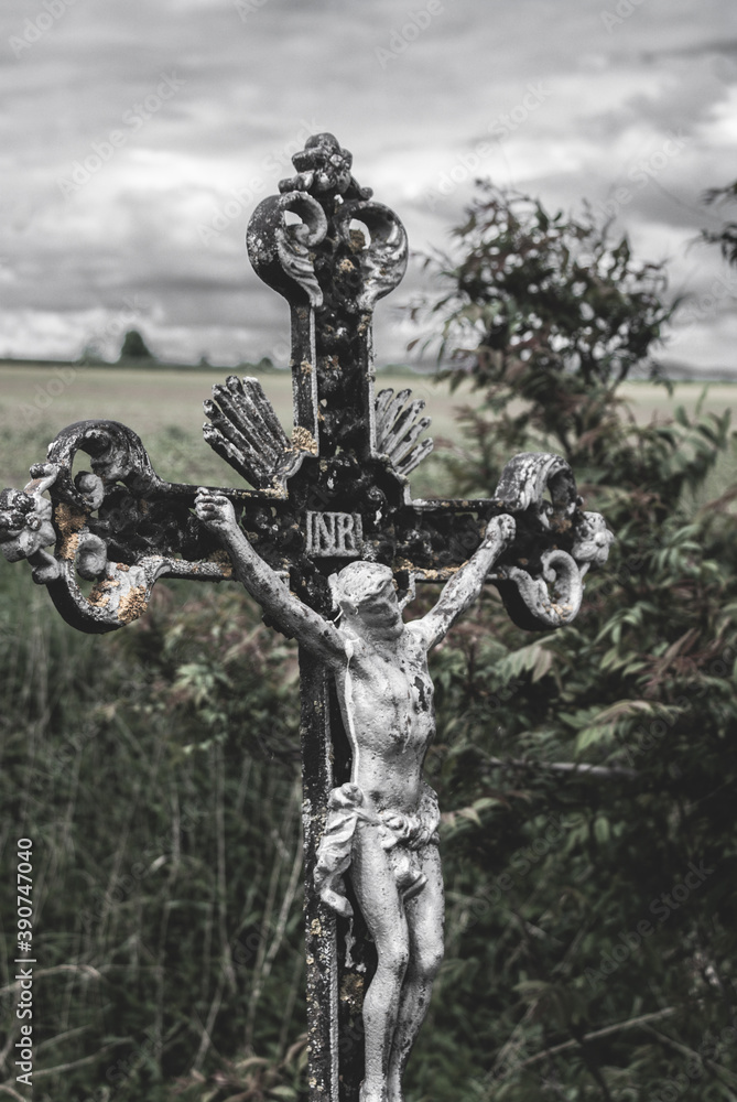 Vertical shot of a cross with attributes of Jesus Christ Stock Photo ...