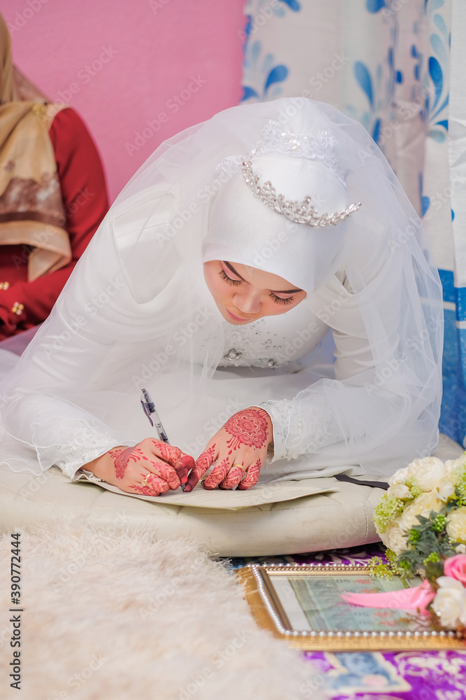 A muslim bride getting solemnization . Malay Traditional Wedding. In a ...