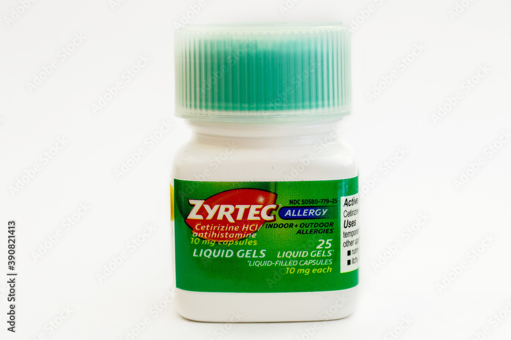 Bottle of Zyrtec capsules stands against white background. Stock Photo ...
