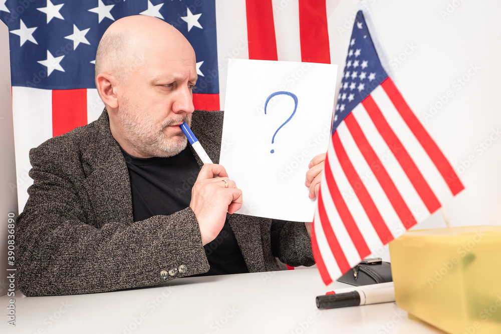 US presidential election campaign. American voter holds a question mark ...