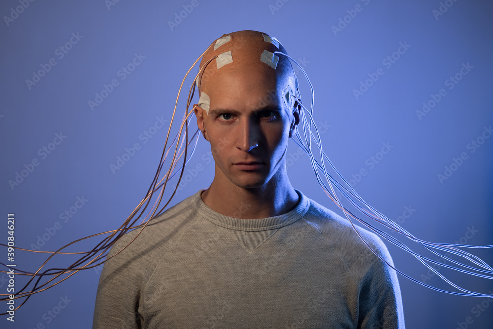 man with electrodes in his head is a futuristic concept of virtual ...