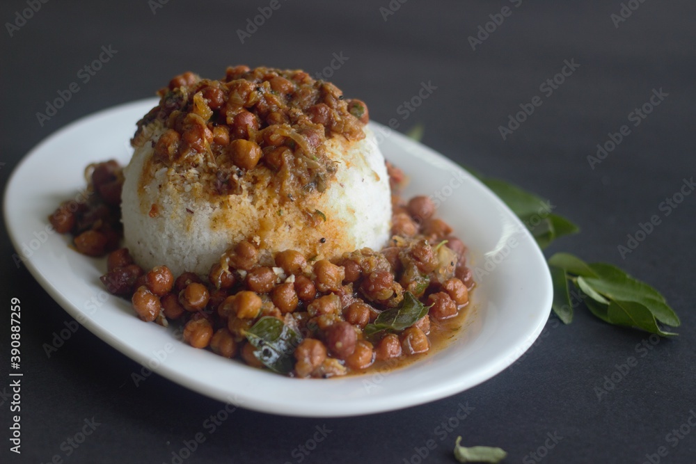 Steamed rice cake with layers of freshly grated coconut in between, a ...