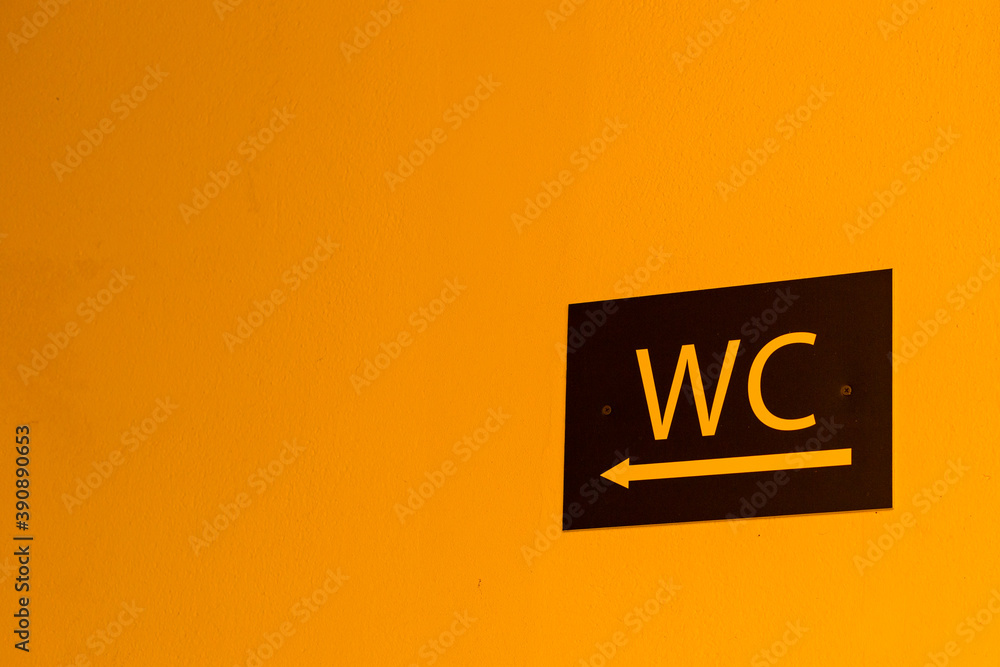 Toilet sign and direction on yellow background. Public restroom signs ...