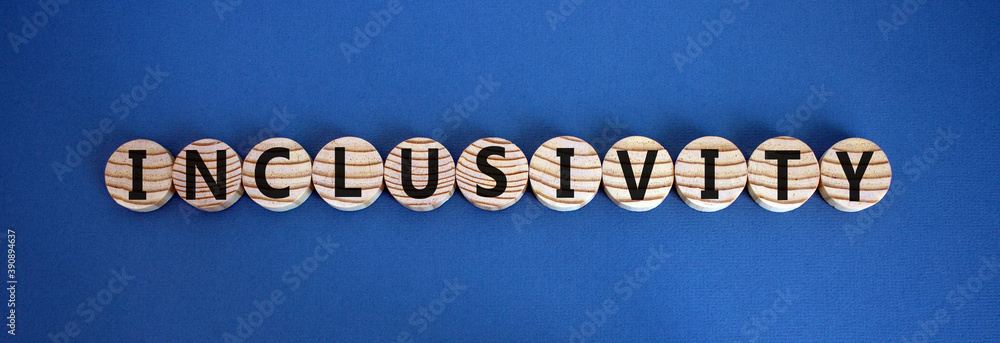 Symbol for a better inclusion. Wooden circles with word 'inclusivity ...