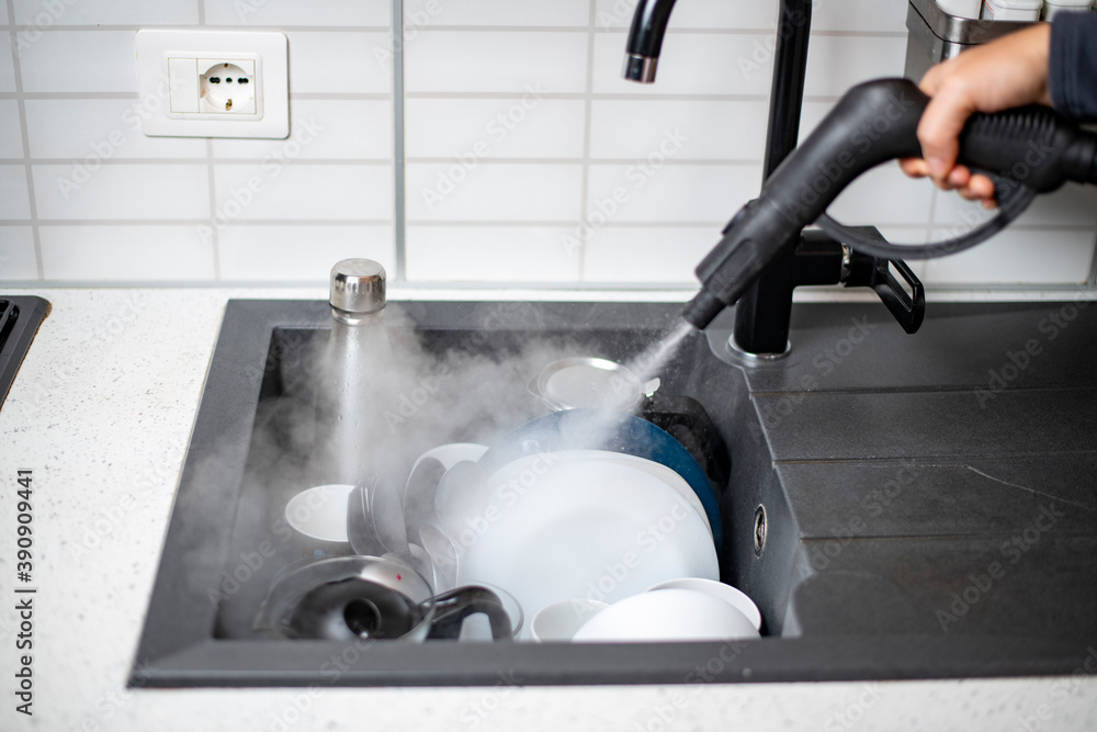disinfection and sanitization of the house, steaming dishes in the ...