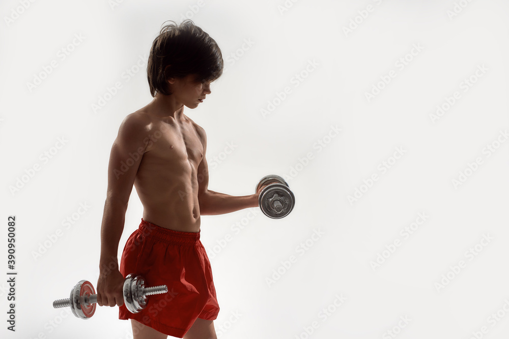 Little sportive boy child with muscular body exercising, showing his ...