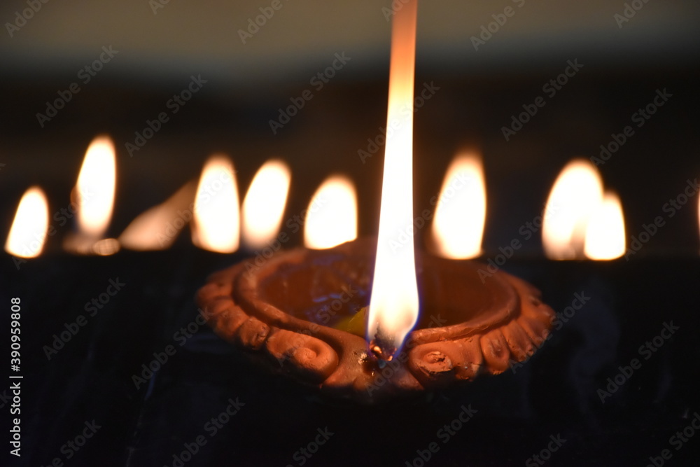 Clay Diya or Oil Lamp lits during the Diwali night. Traditional Diyas ...