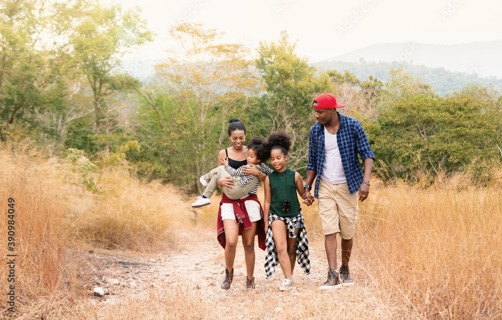 Happy big African family with father, mother holding her daughter and ...