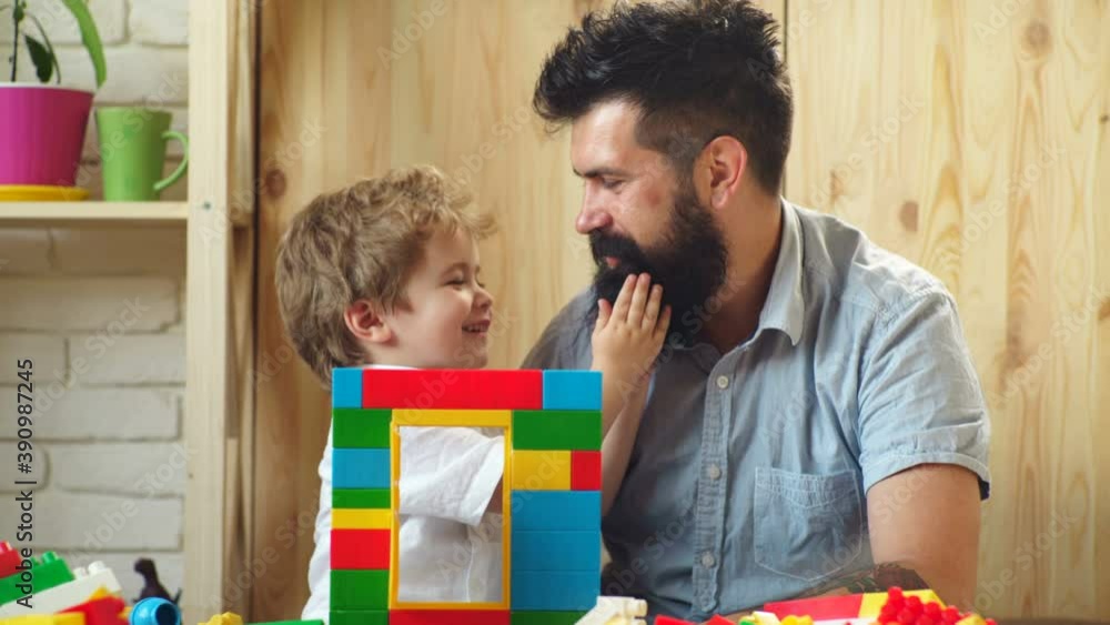 Smiling father and preschooler son hug cuddle together, happy dad and ...