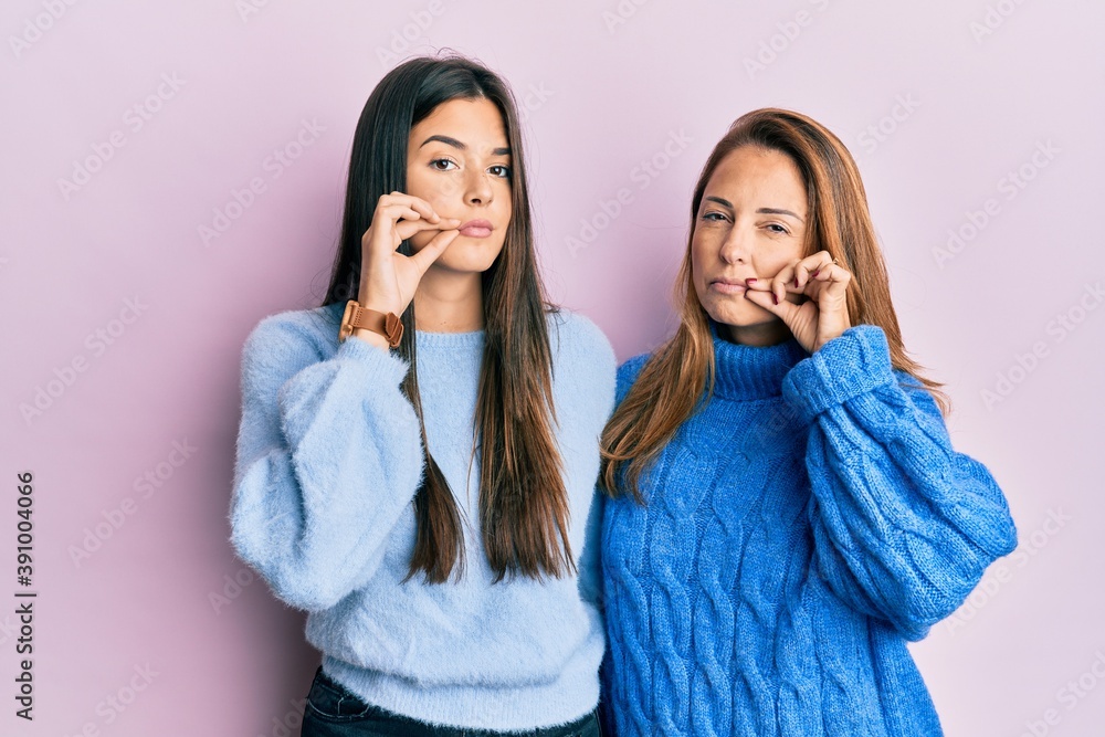 Hispanic family of mother and daughter wearing wool winter sweater ...