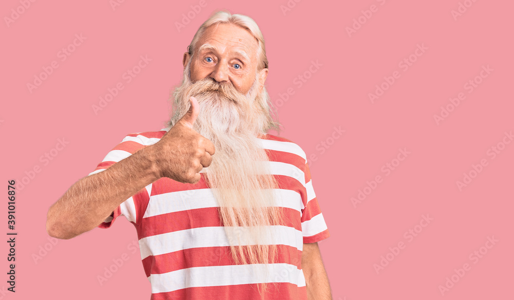 Old senior man with grey hair and long beard wearing striped tshirt ...
