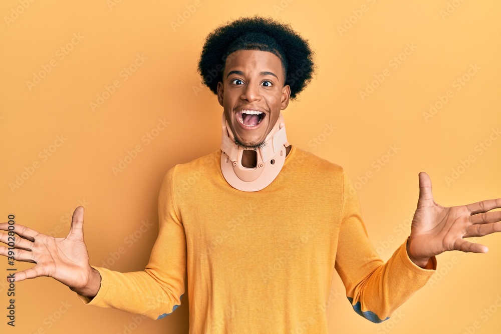 African american man with afro hair wearing cervical neck collar ...