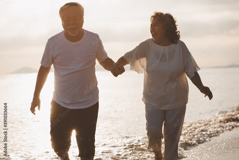 Elderly Couple Walking Hand In Hand