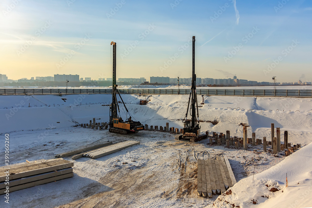 Pile driving in foundation pit. construction of apartment building ...