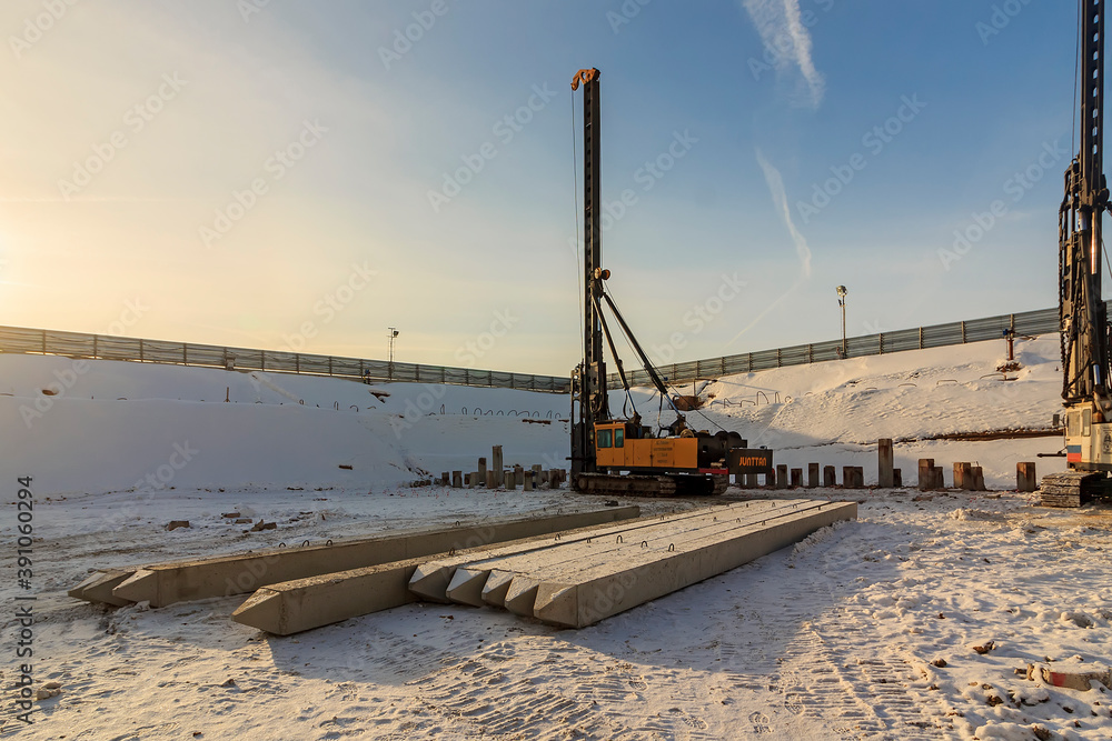 Pile driving in foundation pit. construction of apartment building ...