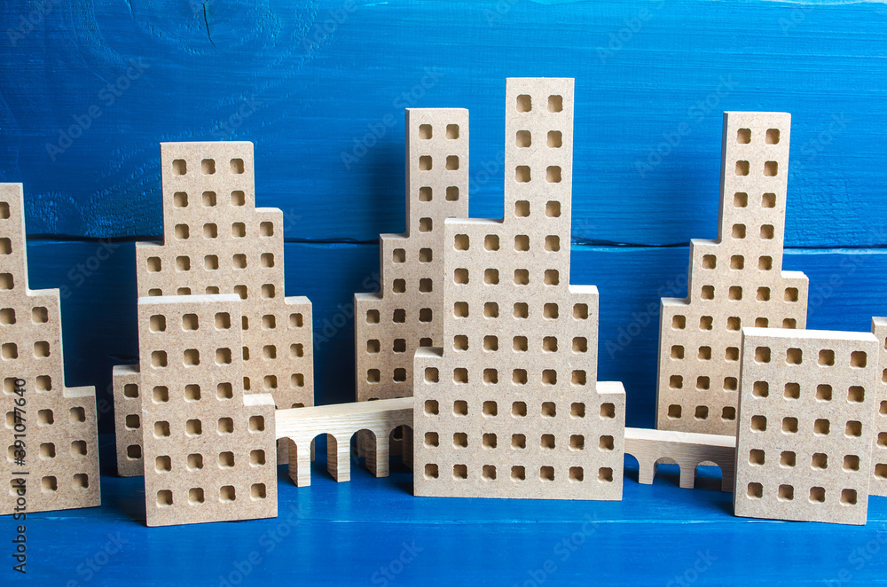 A large city of skyscrapers and overpass flyovers made of figures. Real ...