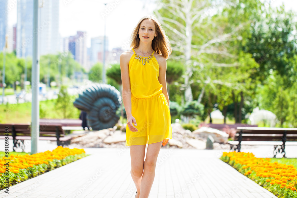 Full body portrait of a young blonde girl in yellow dress Stock Photo ...