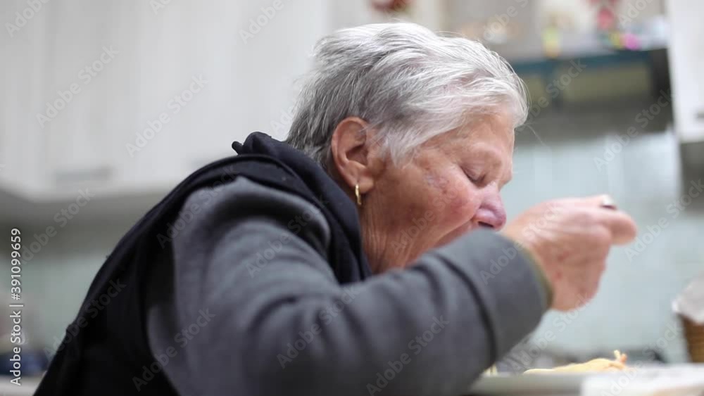 Older Caucasian woman eating spaghetti 80 years old up of healthy old ...