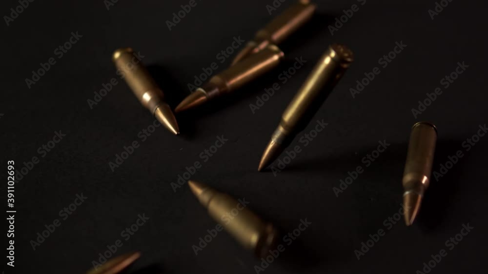 golden cartridges from an automatic rifle on a black background Stock ...