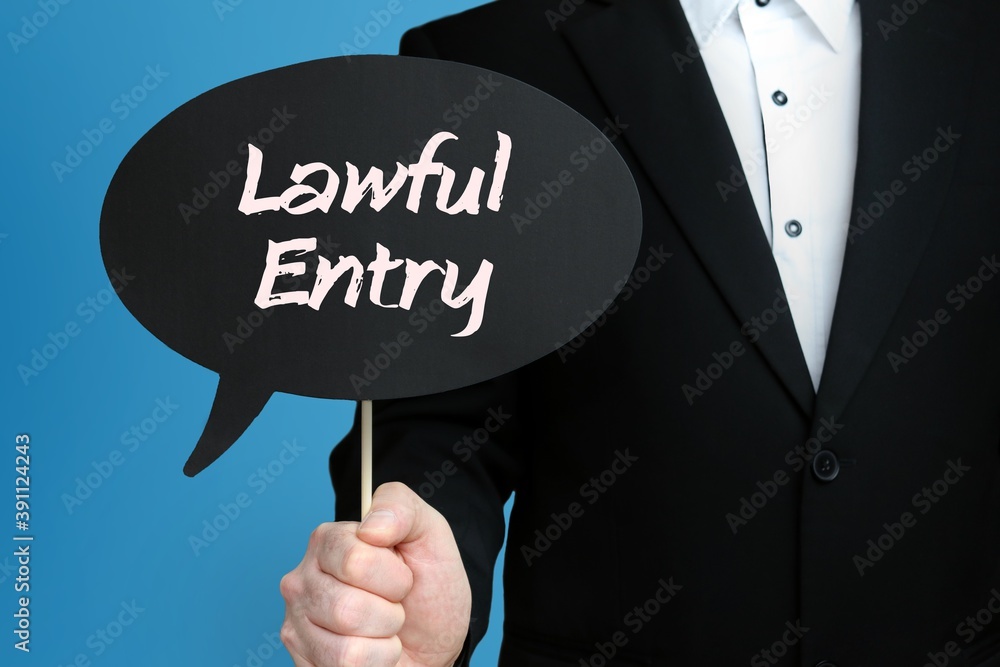 Lawful Entry. Businessman holds speech bubble in his hand. Handwritten ...