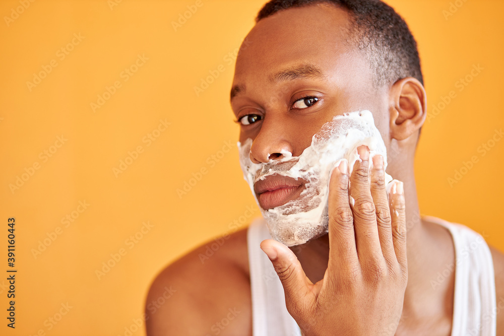 black african man apply foam shaving after shower, do beauty skin ...
