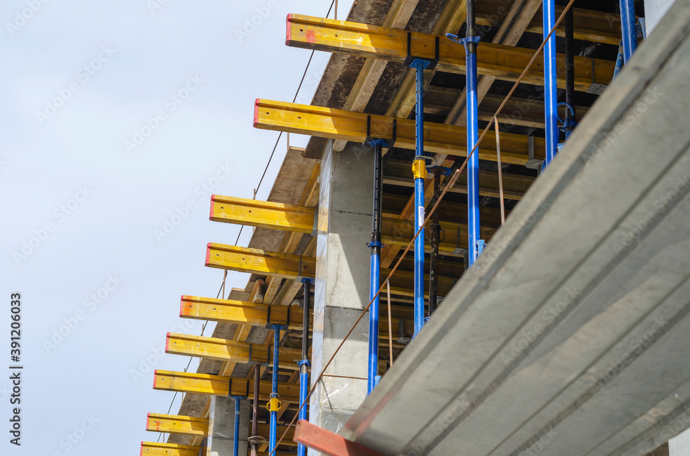 Many support and load-bearing beams and pillars on one of the levels ...
